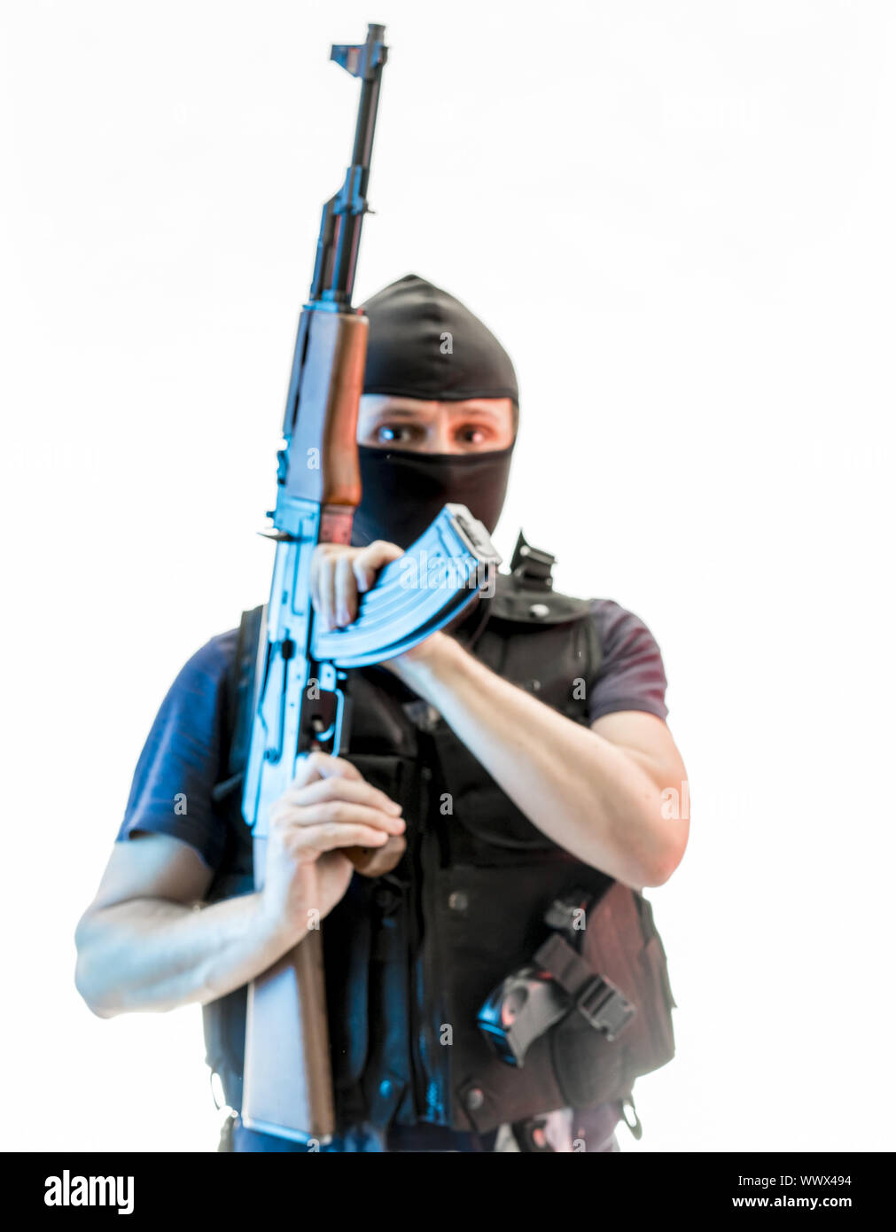 Terrorism, man armed with balaclava and bulletproof vest, gun and ...