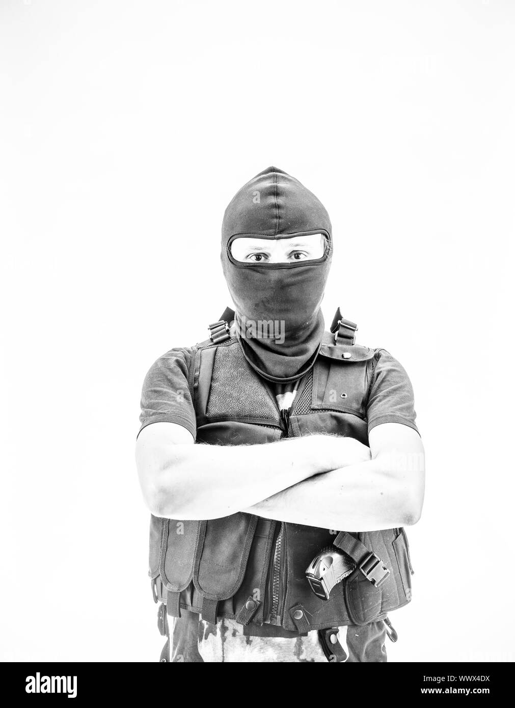 man armed with balaclava and bulletproof vest, gun and shotgun ...