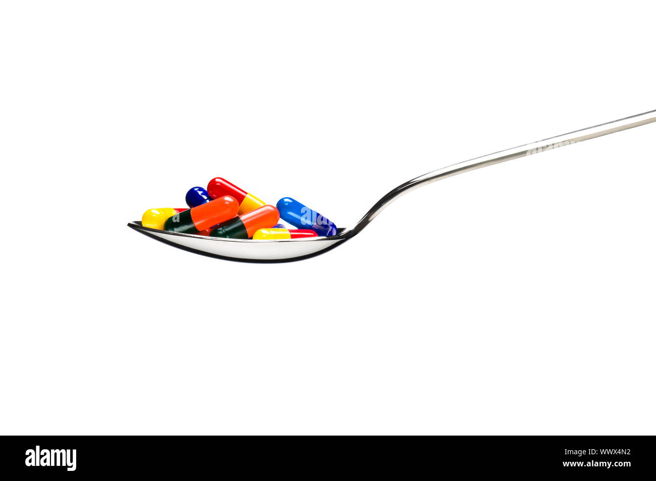 One spoon of medication over white Stock Photo - Alamy