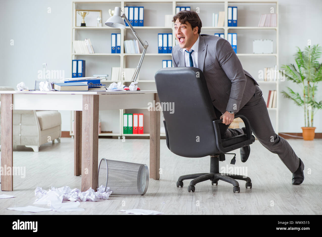 Businessman having fun taking a break in the office at work Stock Photo ...