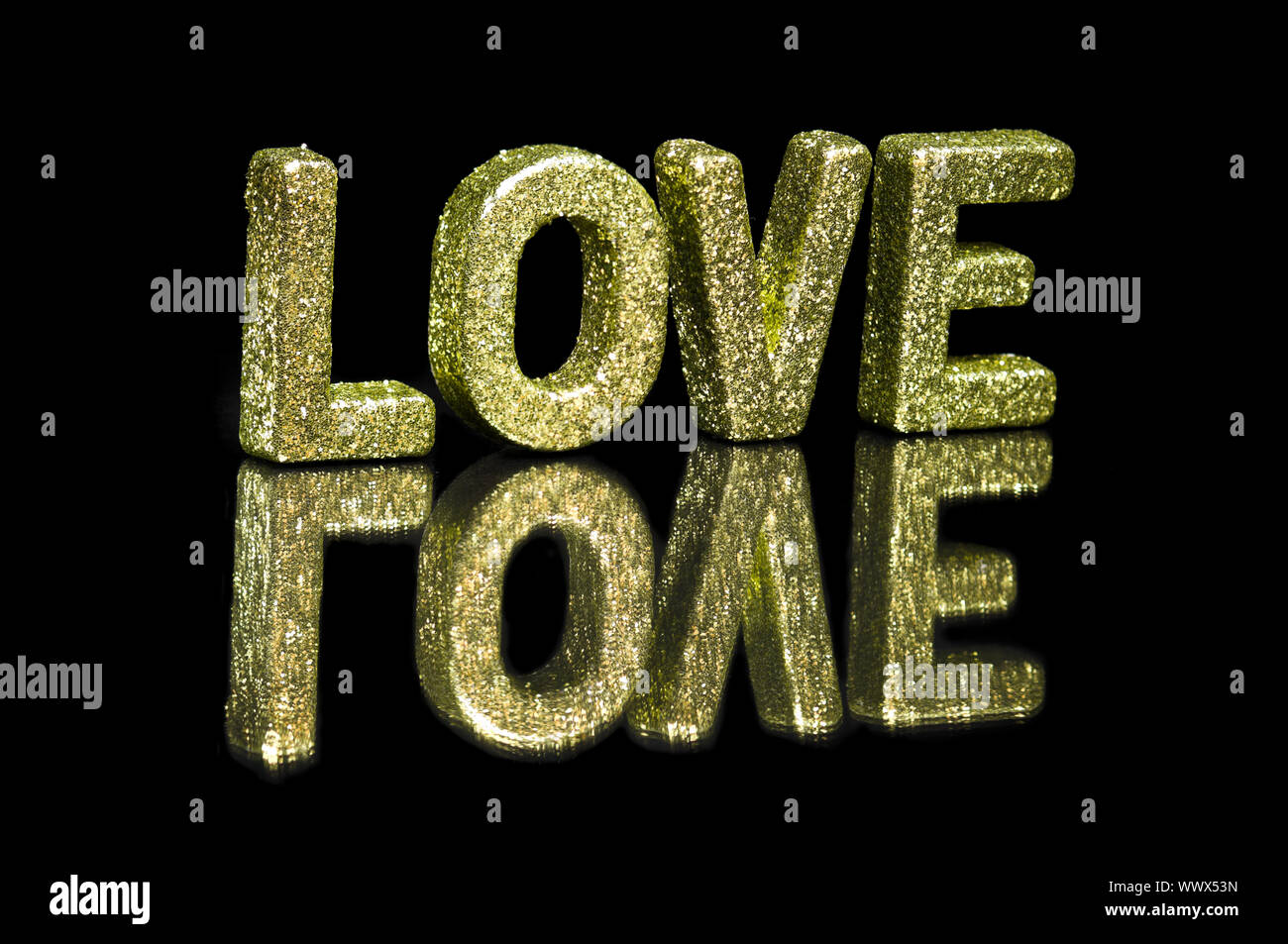 In capital letter written love, glitter effect Stock Photo - Alamy