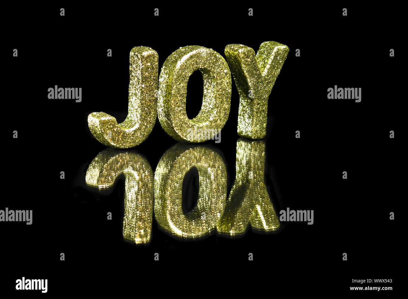 In capital letter written joy, glitter effect Stock Photo - Alamy