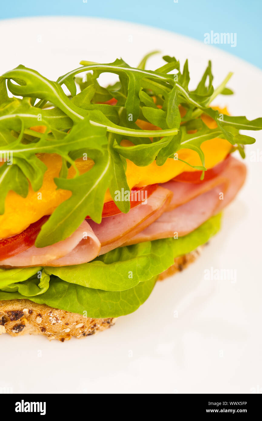 Open sandwich with melted cheese Stock Photo - Alamy