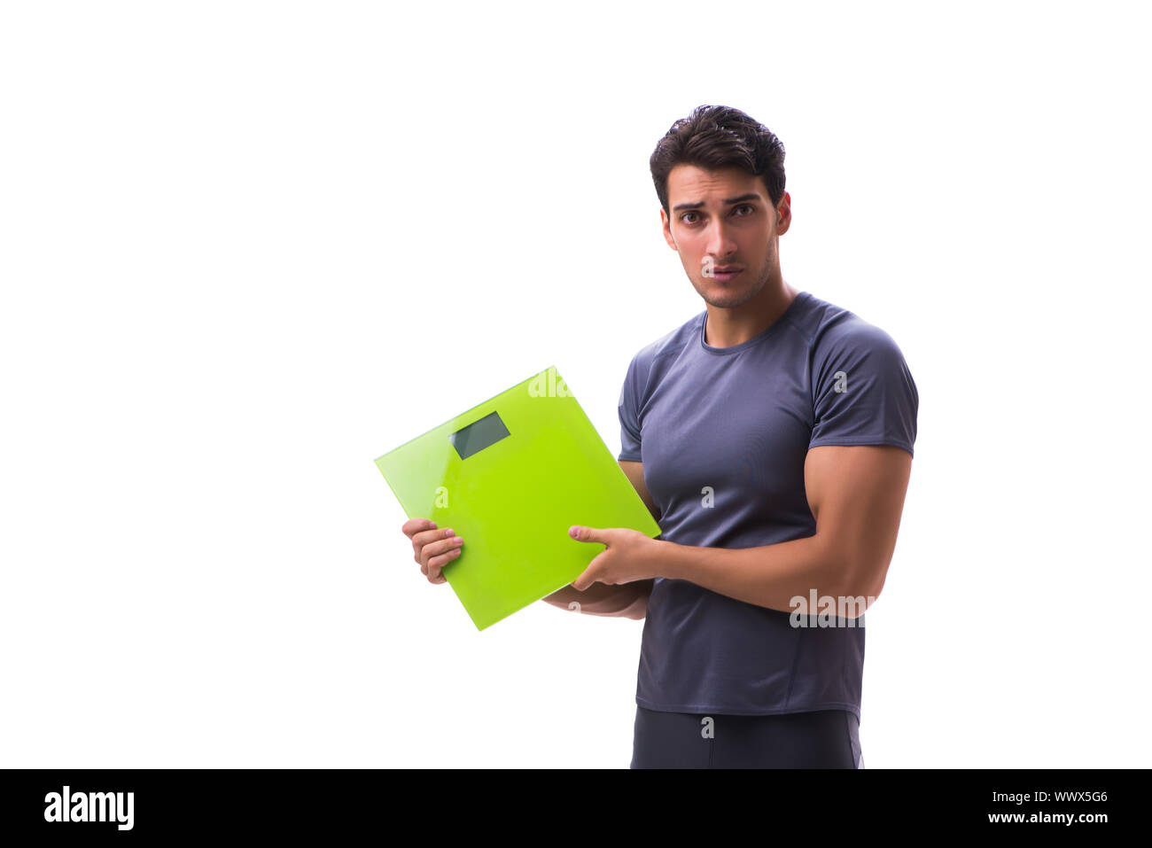 Man with scales in sports and health concept isolated on white Stock ...