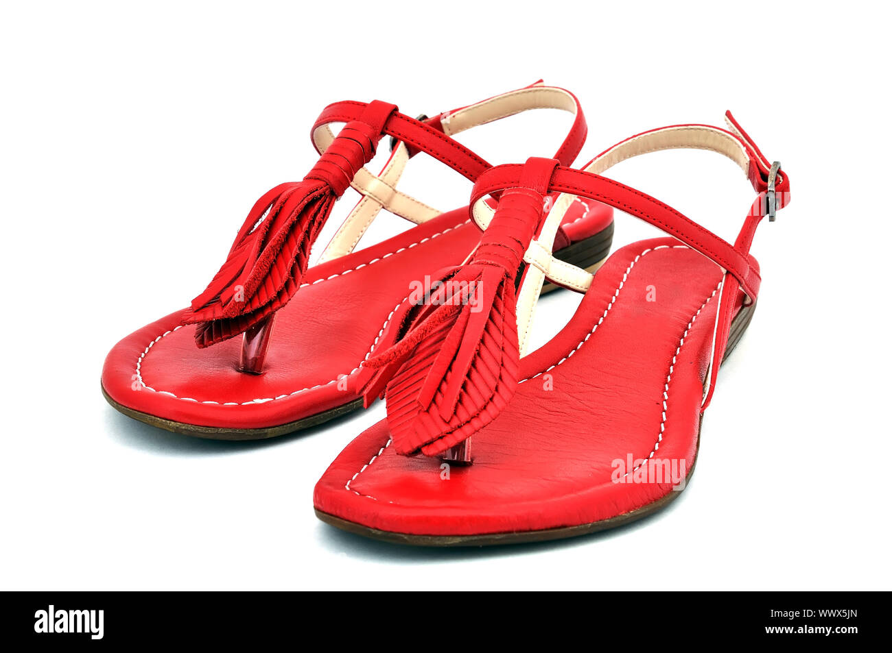 two red sandals with white background Stock Photo - Alamy