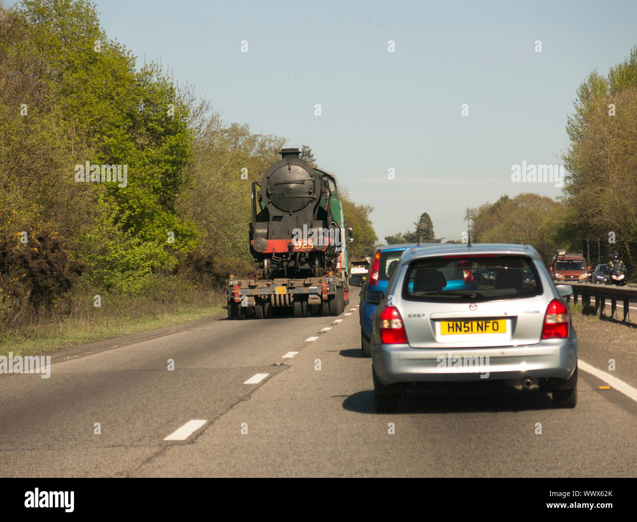 Locomotive being transported by heavy goods vehicle on A31 2015 Stock ...