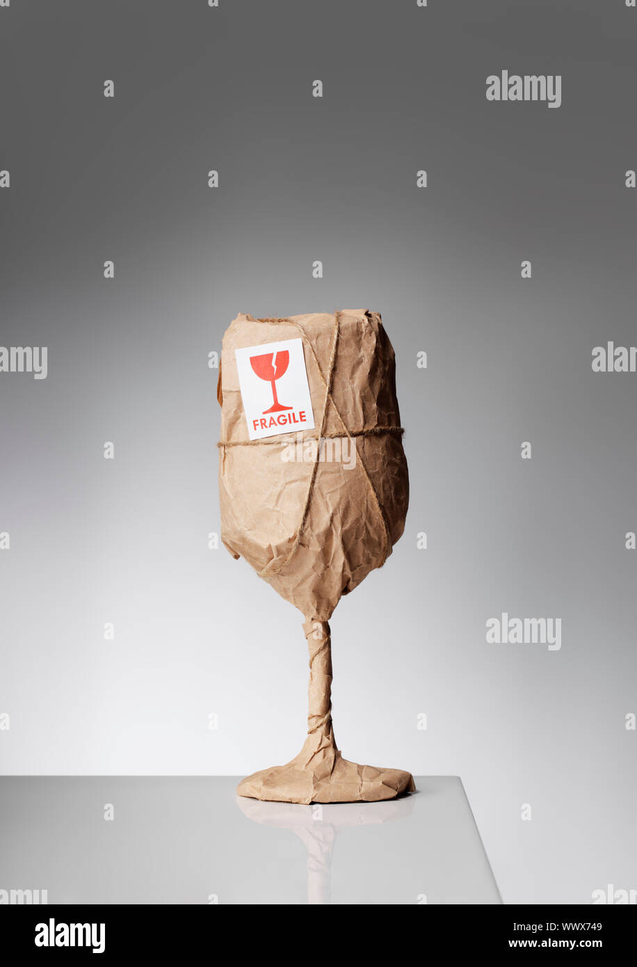 An obviously fragile object wrapped in paper and with a "fragile ...