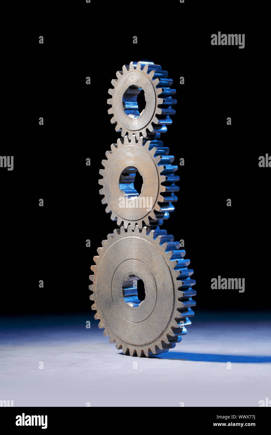 Still life with three cog gear wheels stacked on eachother Stock Photo ...