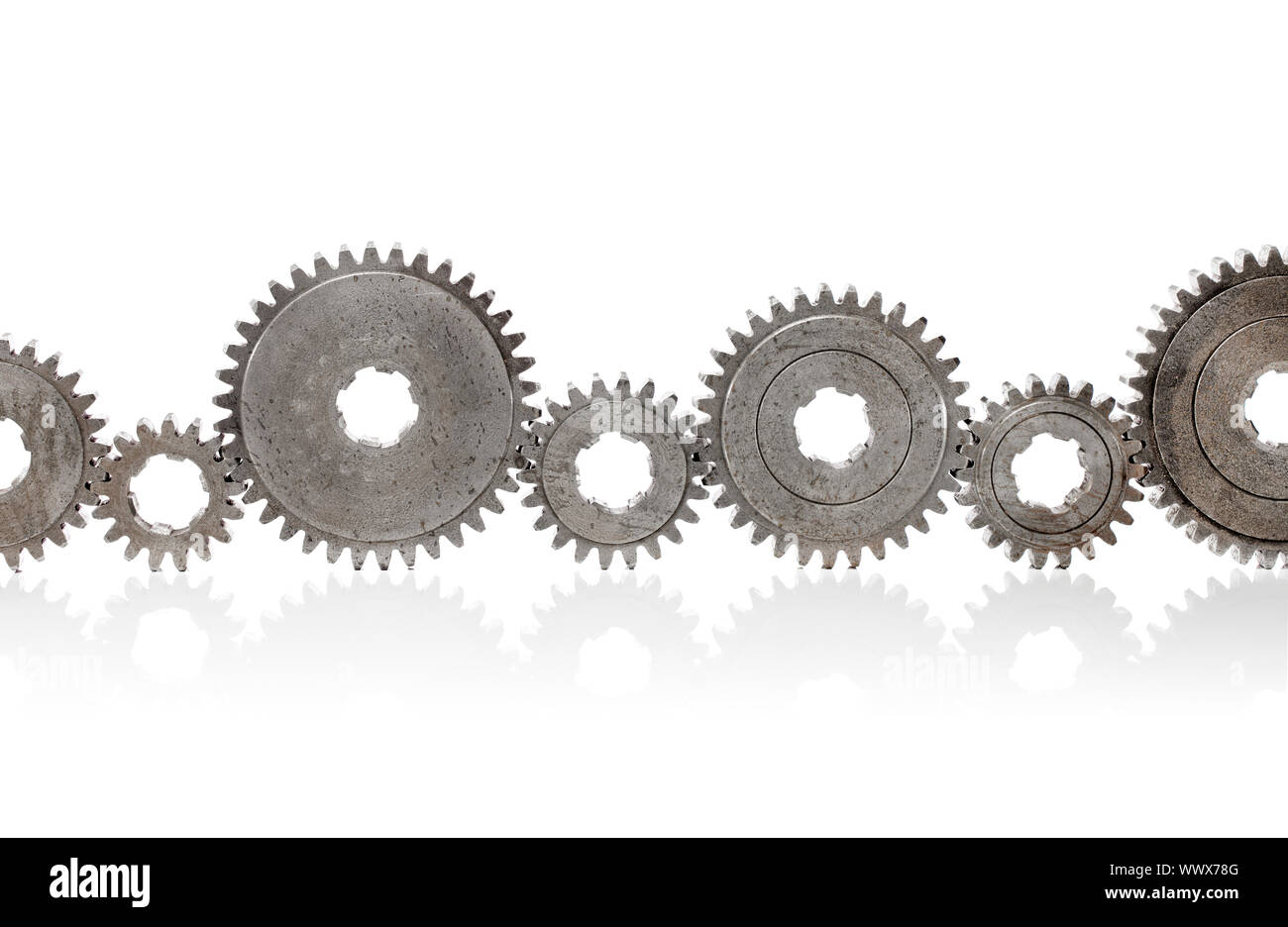 Old metallic cog gears arranged in a row Stock Photo - Alamy