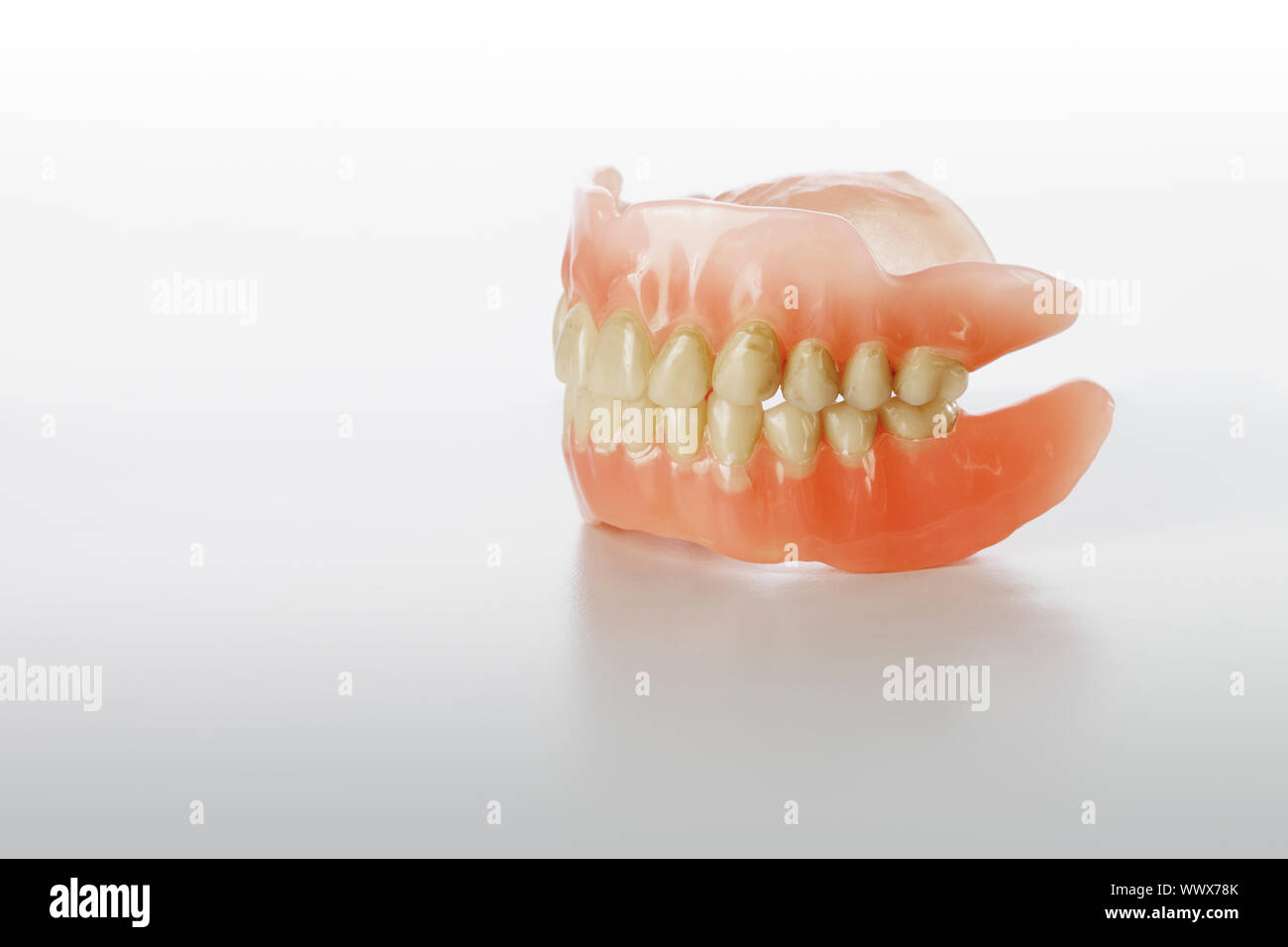 Old Stained Dentures on light grey background Stock Photo - Alamy