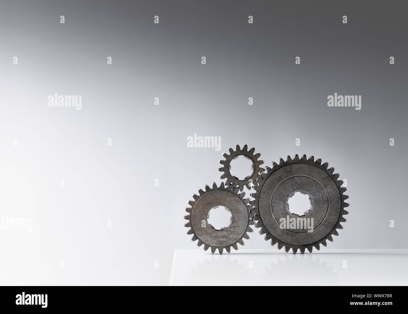 Still life with three old cog gears. Lots of copy space Stock Photo - Alamy