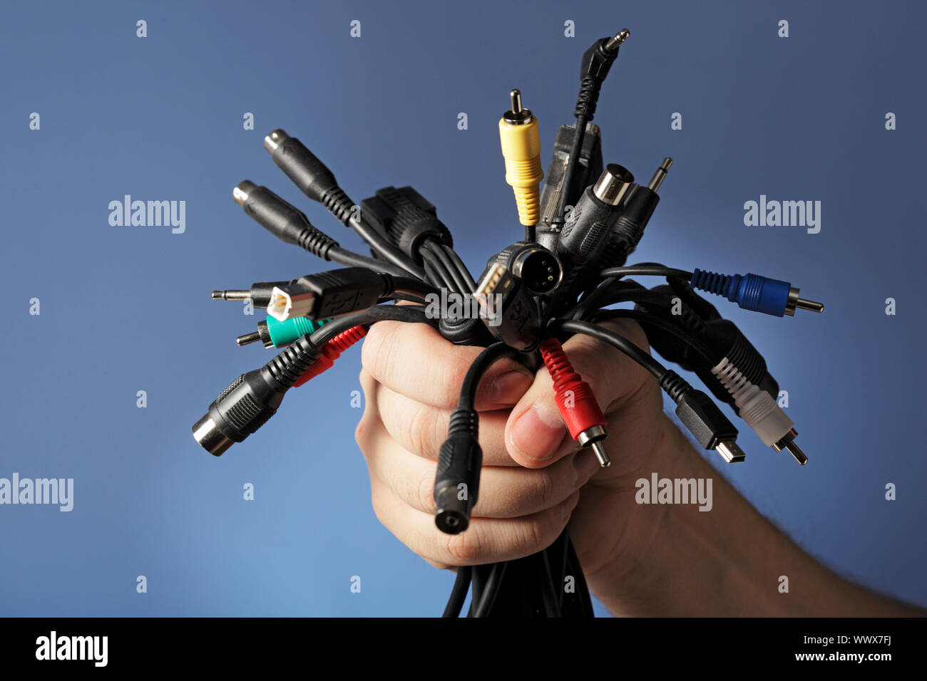 FINLAND - CIRCA 2008: Man holding a bunch of different audio/video and ...