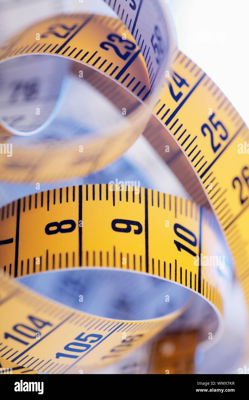 Yellow metric tape measure in closeup Stock Photo - Alamy