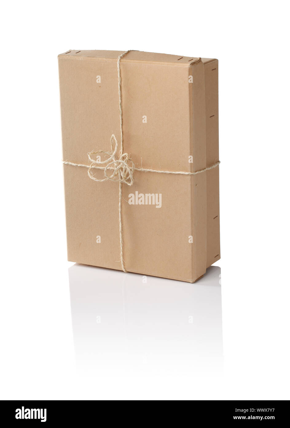 Vintage cardboard box on white reflective background Stock Photo - Alamy