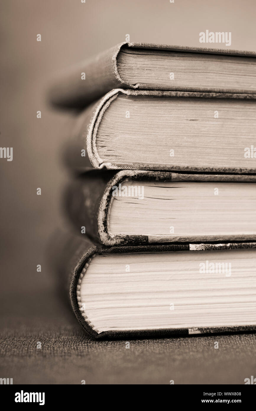 Sepia toned image of stacked old books Stock Photo - Alamy