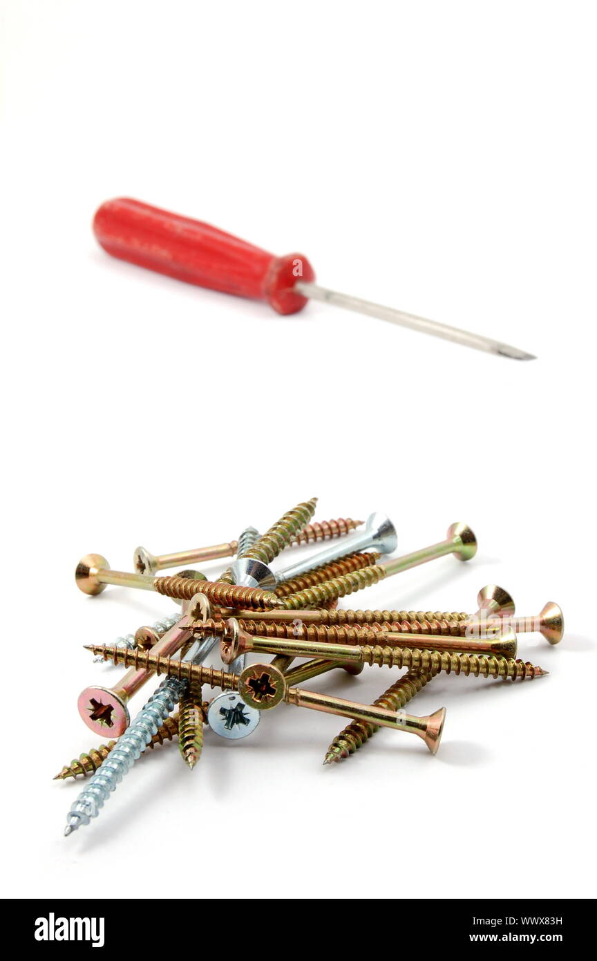 screwdriver and some screws isolated on white background Stock Photo ...
