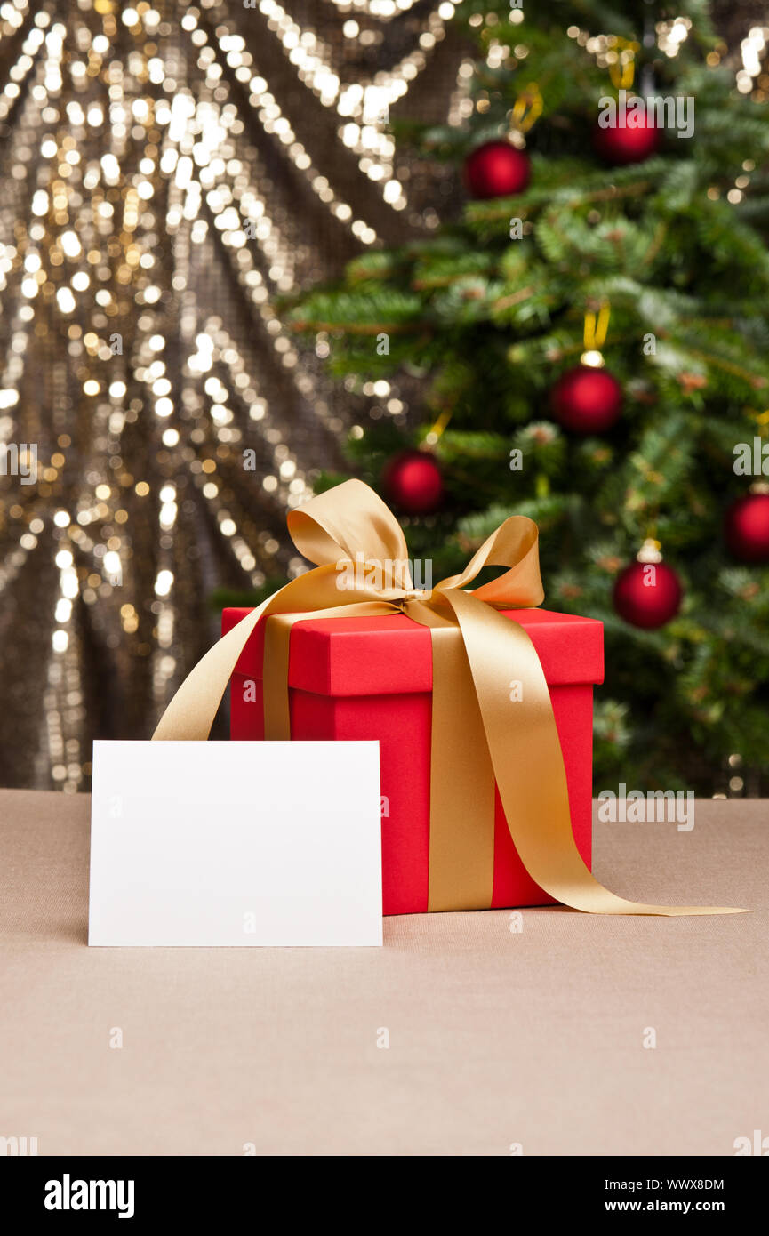 Christmas present with white card Stock Photo - Alamy