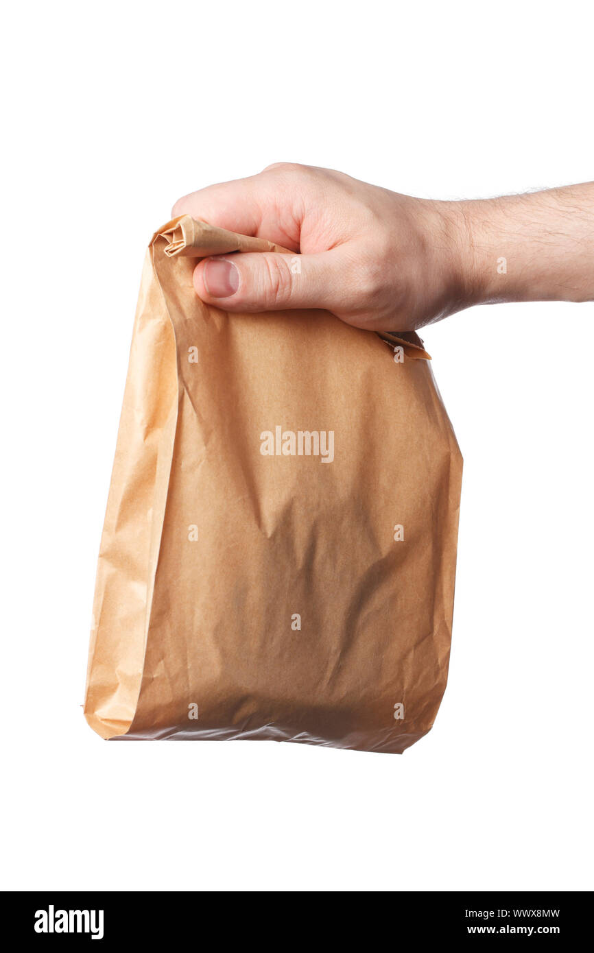 Hand holding brown paper bag Cut Out Stock Images & Pictures - Alamy