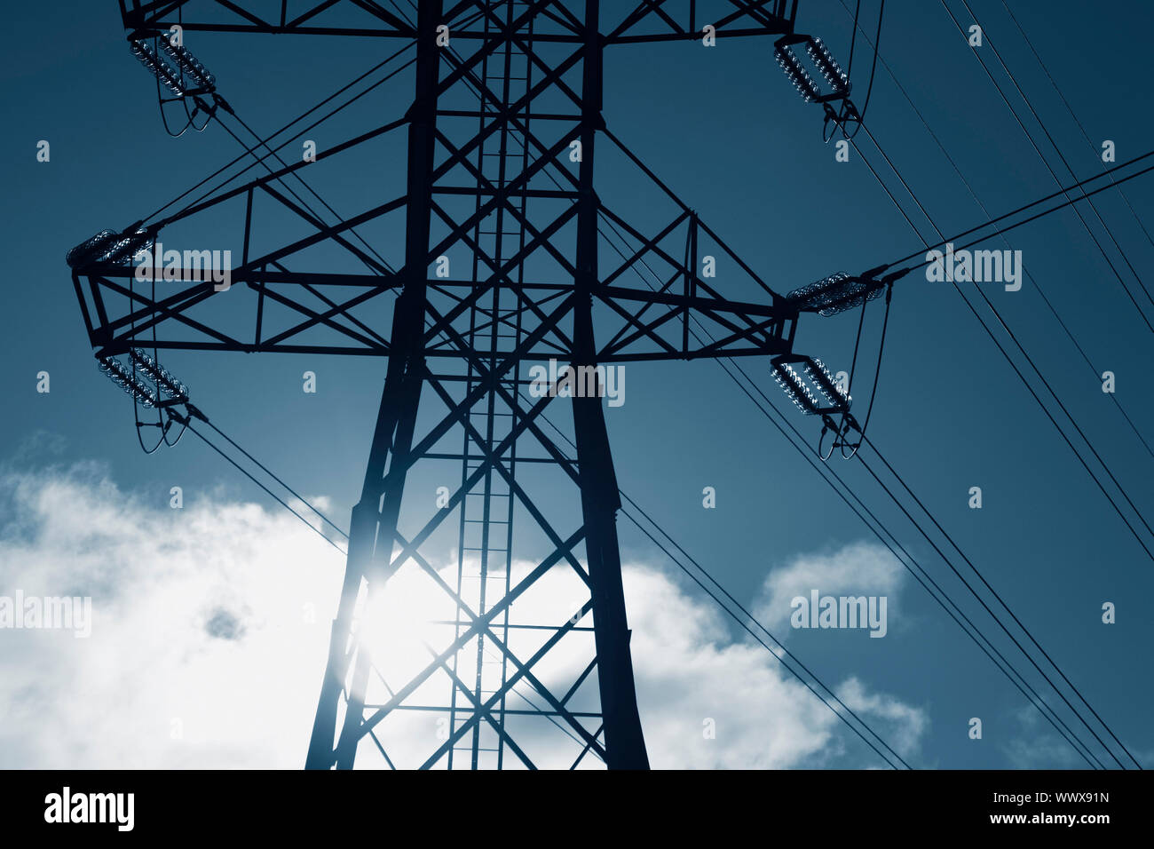 A Blue toned monochrome image of high voltage power cables Stock Photo ...