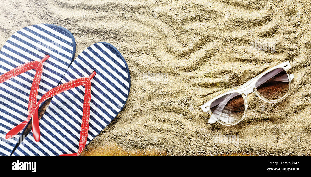 Beach background. Beach slippers and sunglasses Stock Photo - Alamy