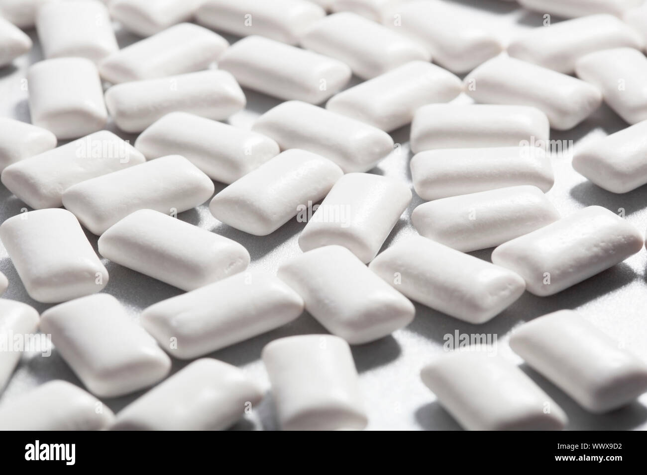 Rectangular white chewing gum on white Stock Photo - Alamy