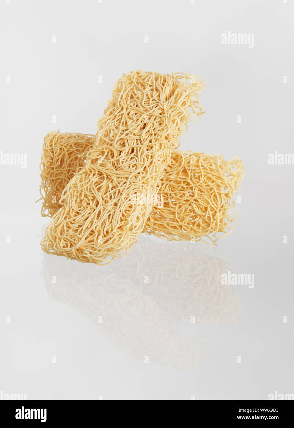 Two blocks of dried asian noodles on reflecting surface Stock Photo - Alamy