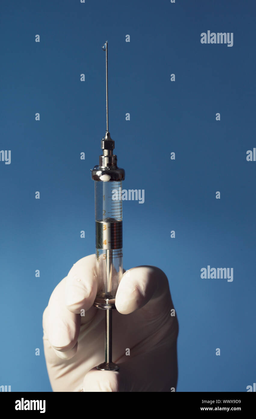 Scary old syringe made of glass and with a thick needle Stock Photo - Alamy