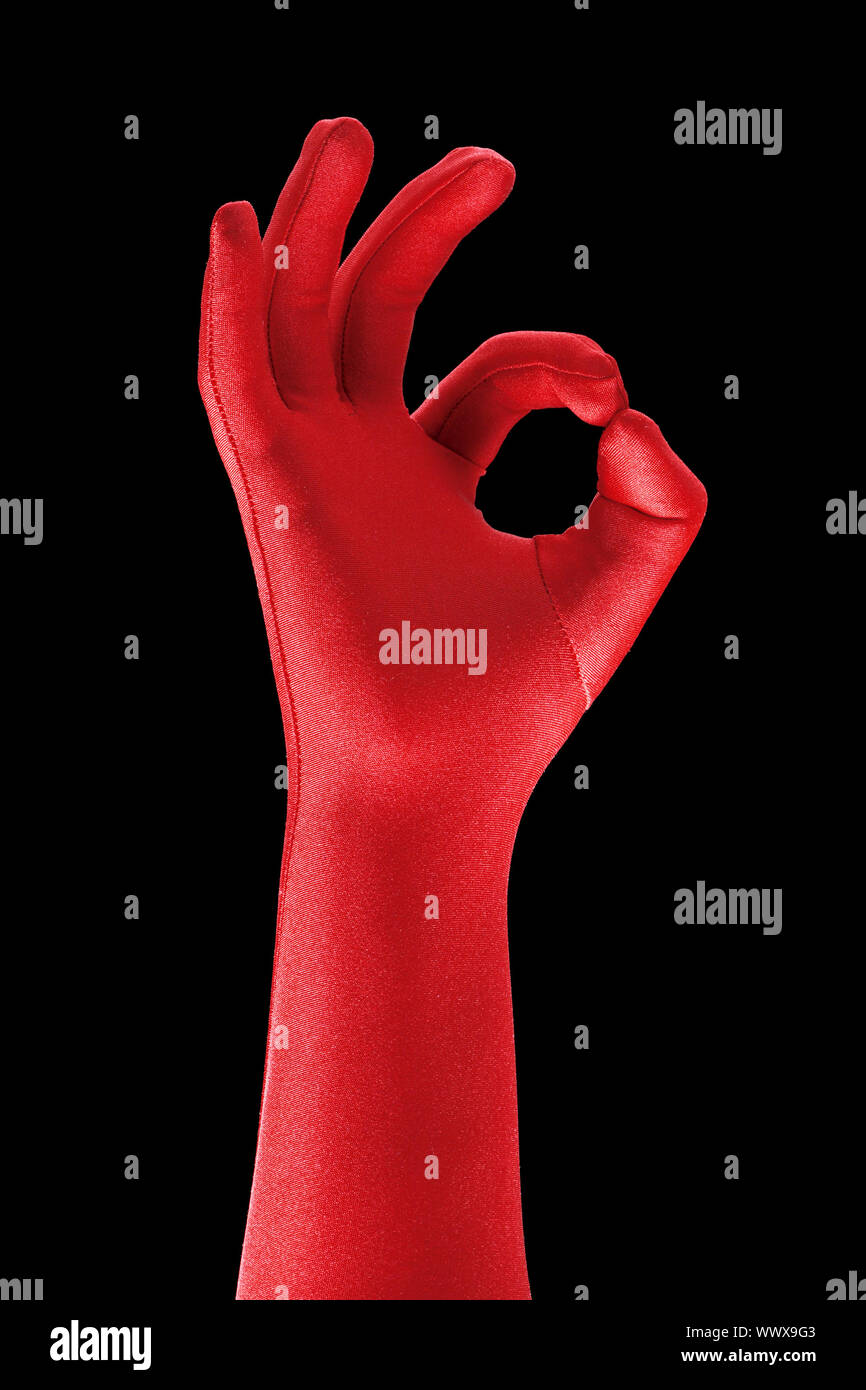 a strange red gloved hand doing OK sign Stock Photo - Alamy