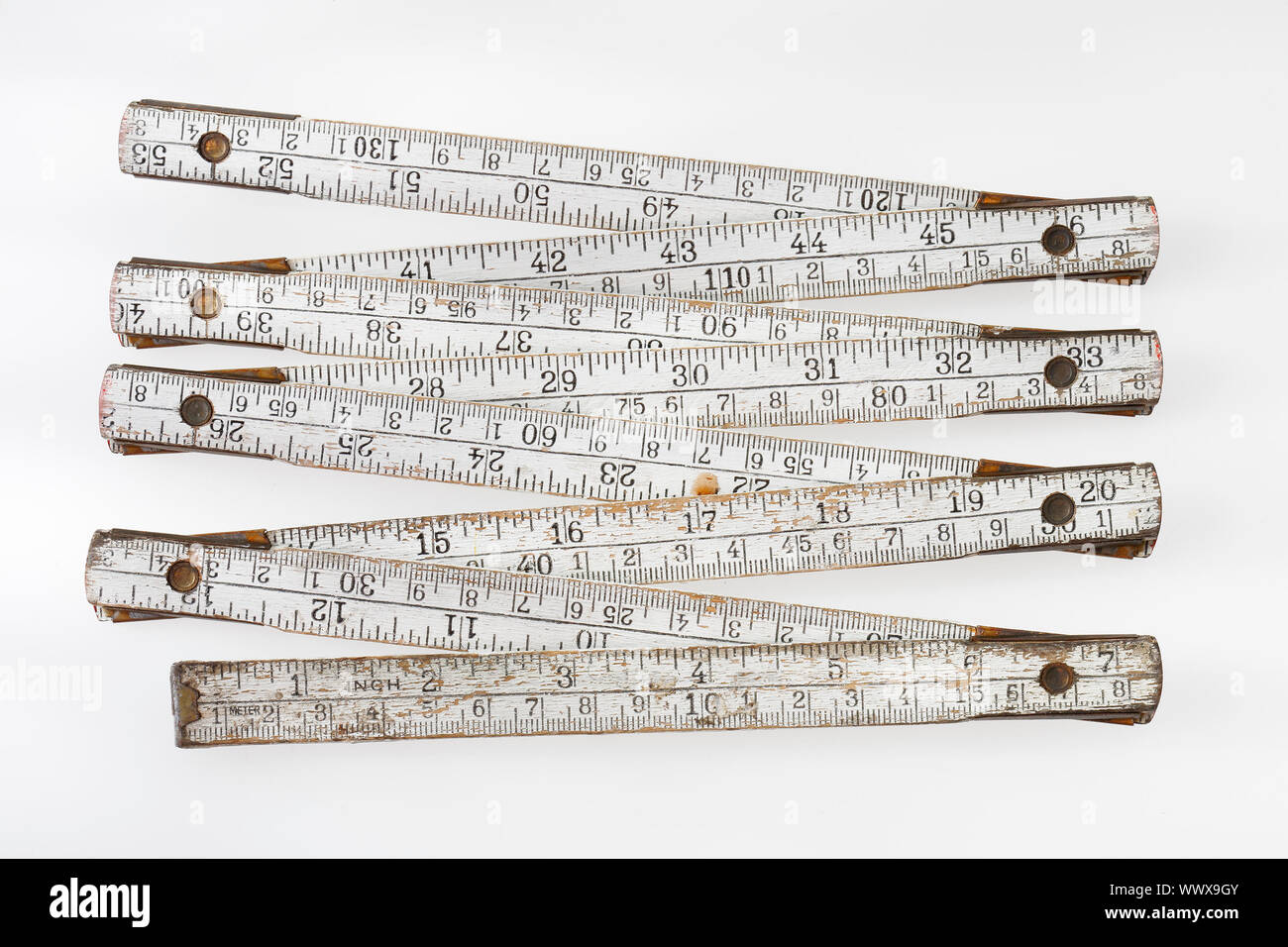 Old and dirty folding carpenter's ruler on light grey background Stock ...