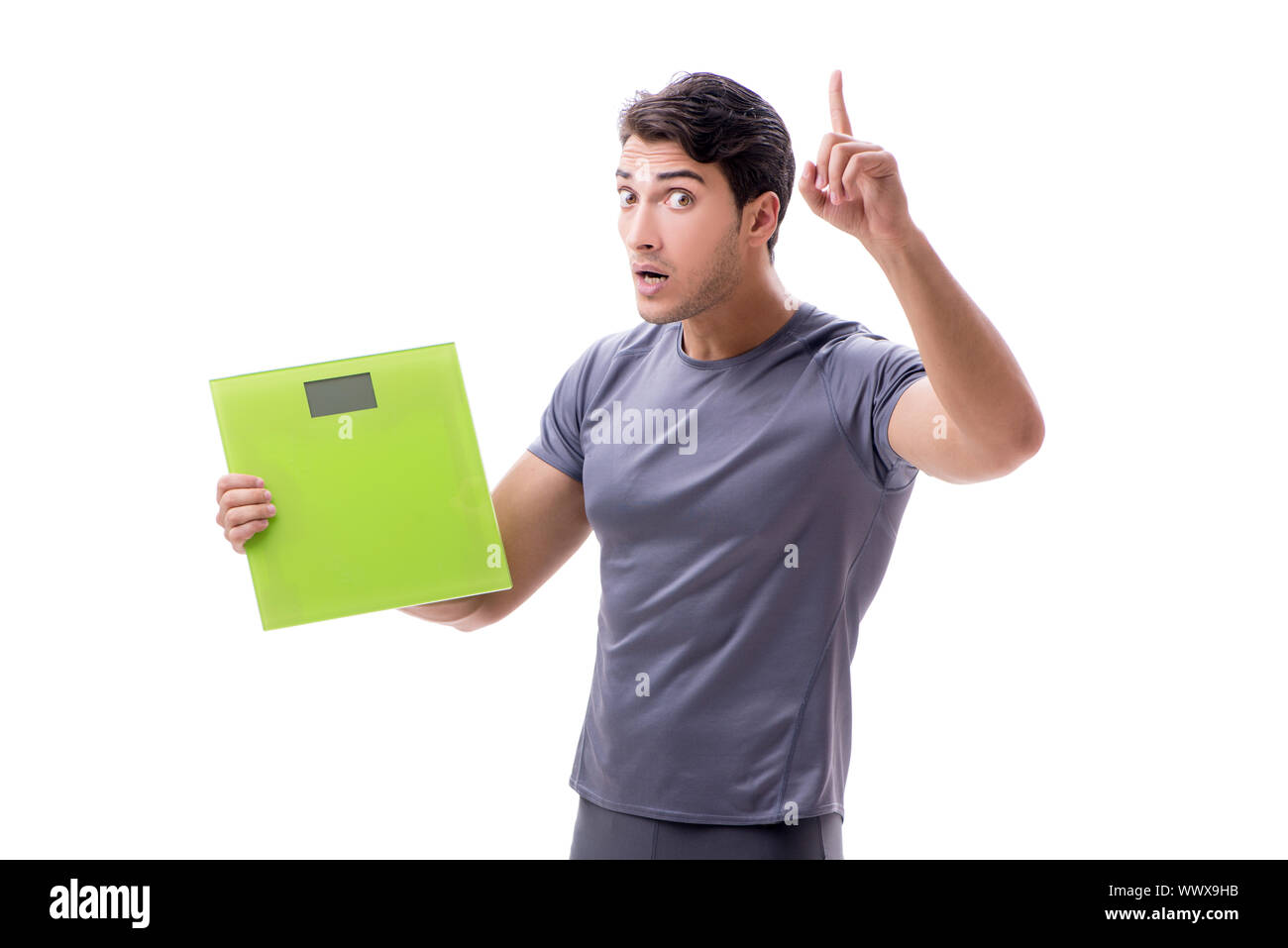 Man with scales in sports and health concept isolated on white Stock ...