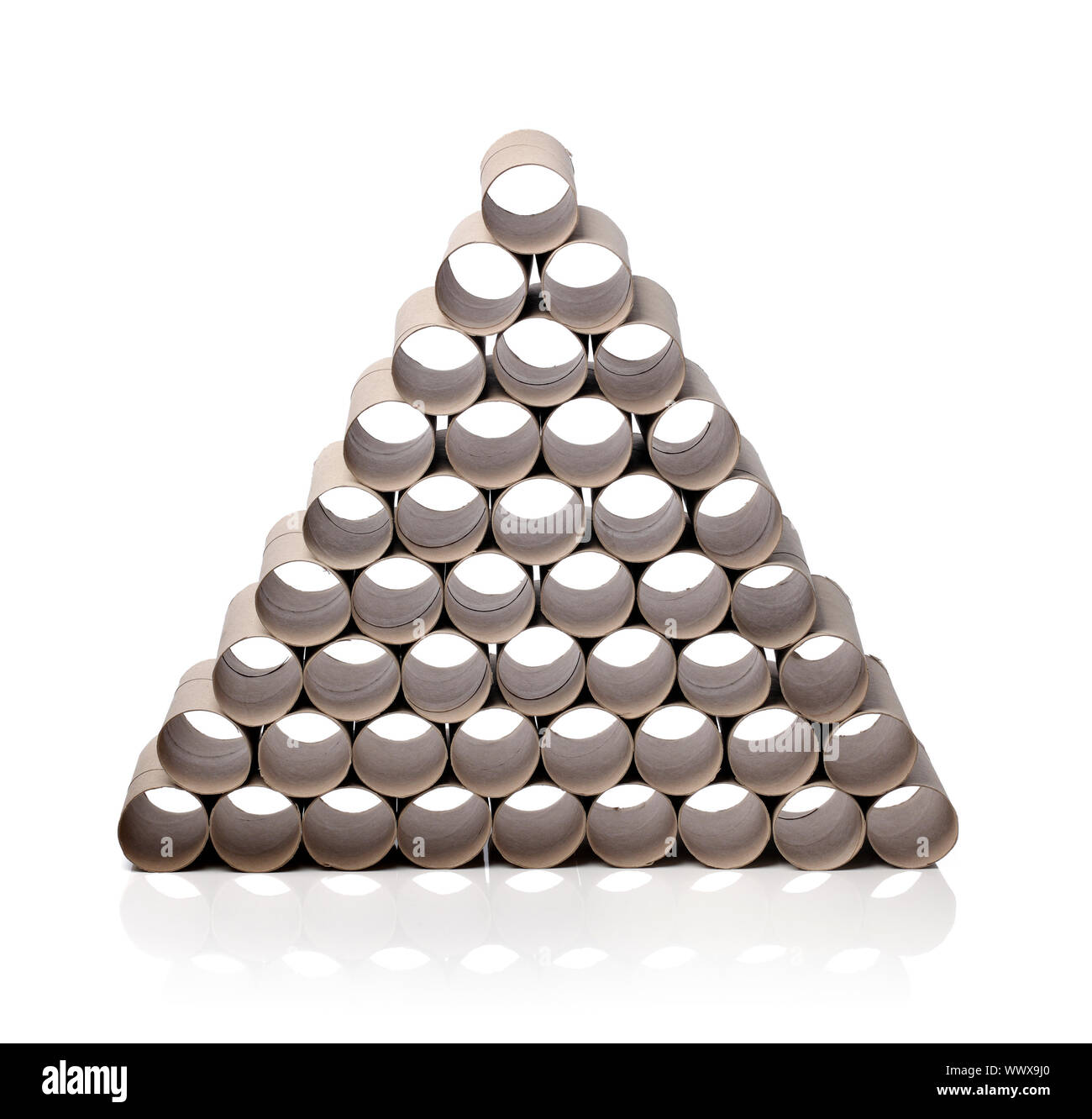 Empty toilet paper rolls stacked in triangle shape formation Stock ...