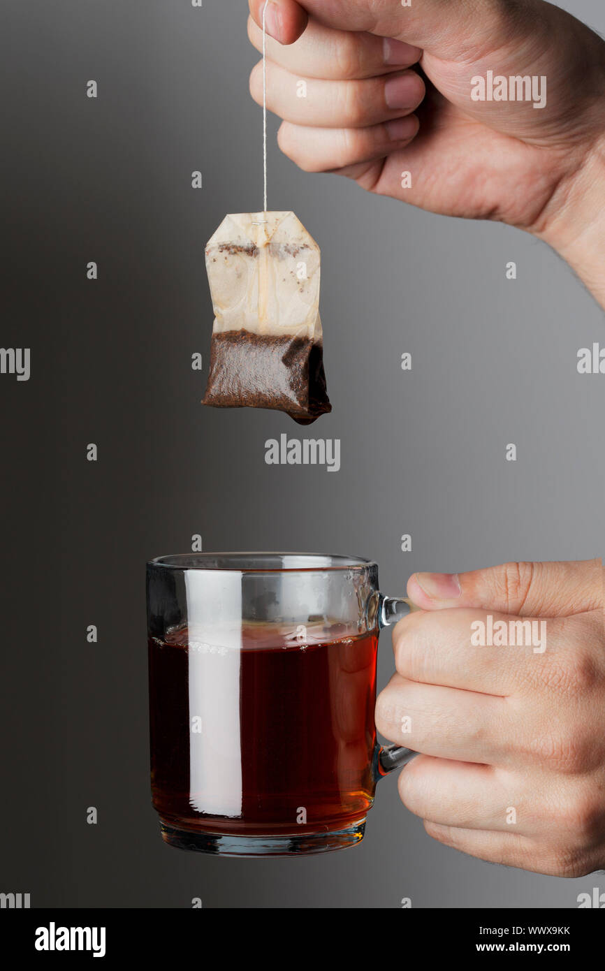Hand lifting mug drink hi-res stock photography and images - Alamy