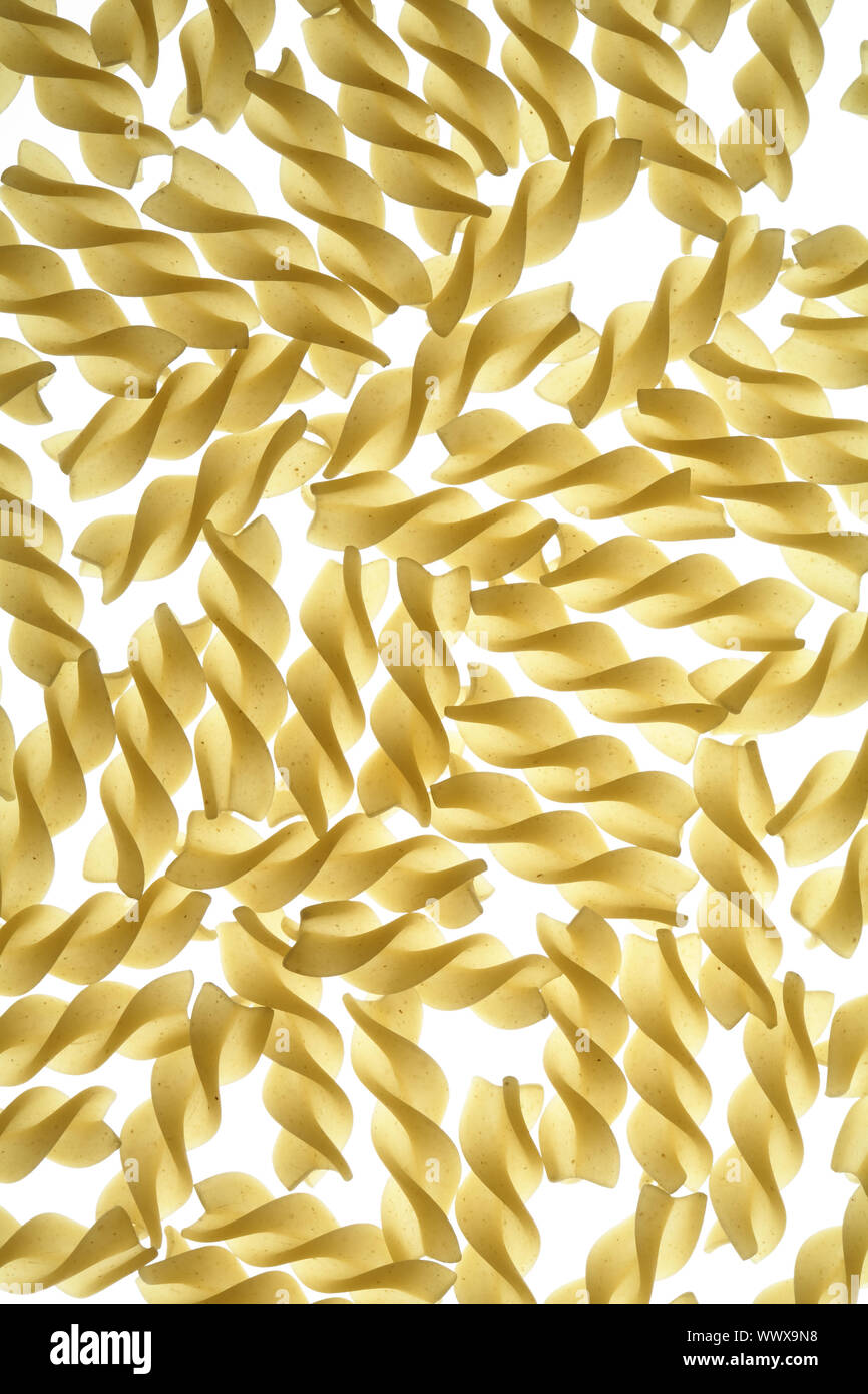 Pasta Fusilli, light from behind Stock Photo - Alamy