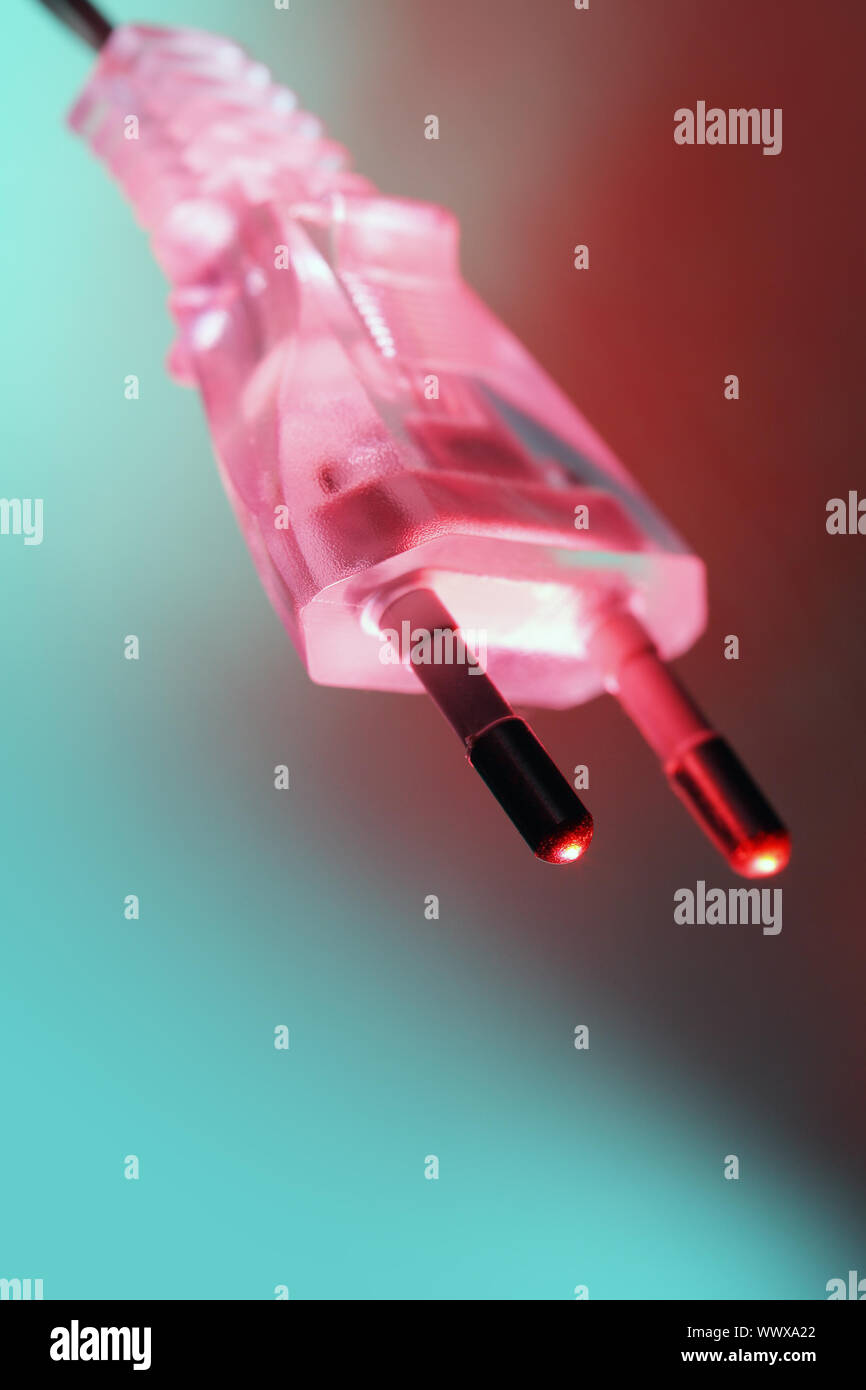 European power plug in colorful lighting Stock Photo - Alamy
