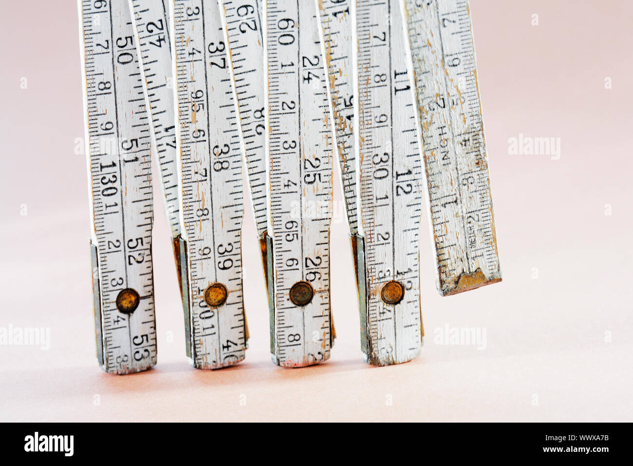 Old worn folding carpenter's ruler in closeup Stock Photo - Alamy