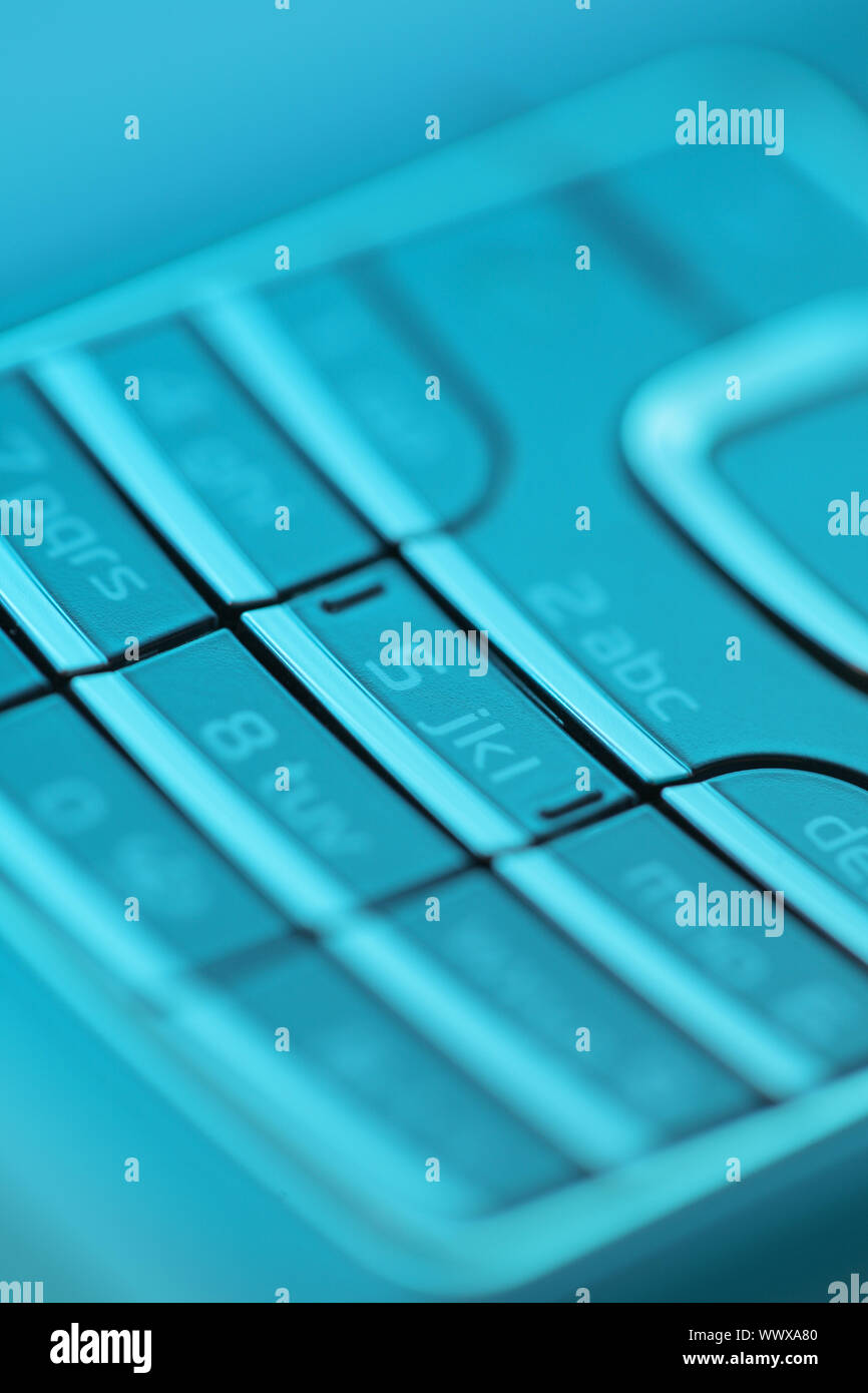 Cell phone keypad in blue light. Short depth of field Stock Photo - Alamy