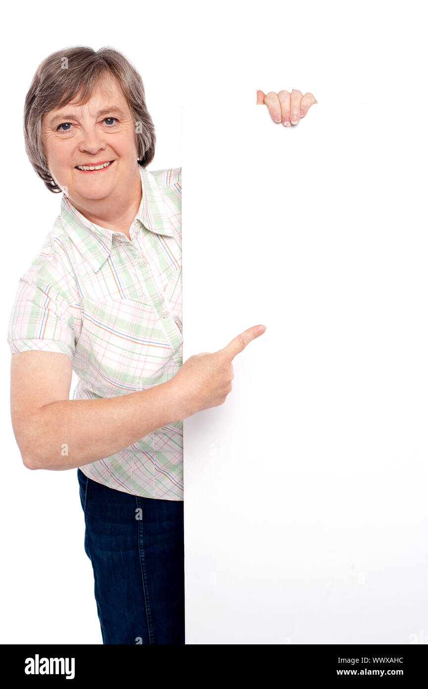 Causal senior lady pointing hi-res stock photography and images - Alamy