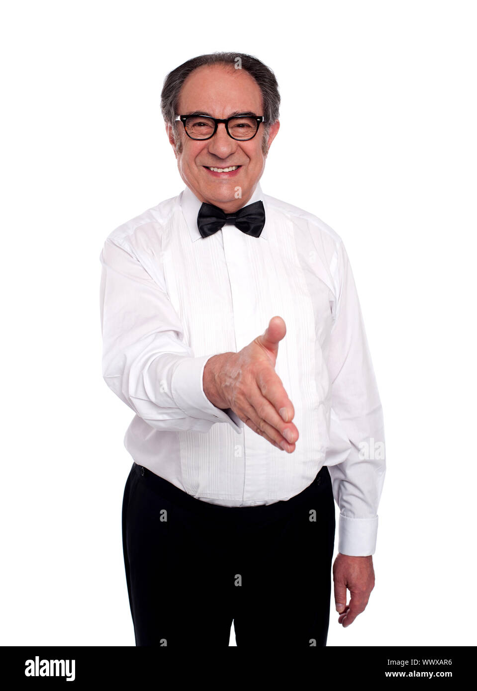 Old man in bow tie and white ceremony shirt offering handshake Stock ...