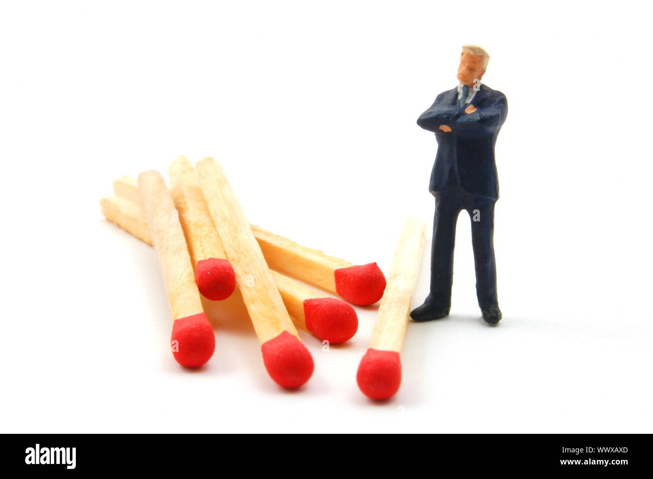 business man and matches isolated on white background Stock Photo - Alamy