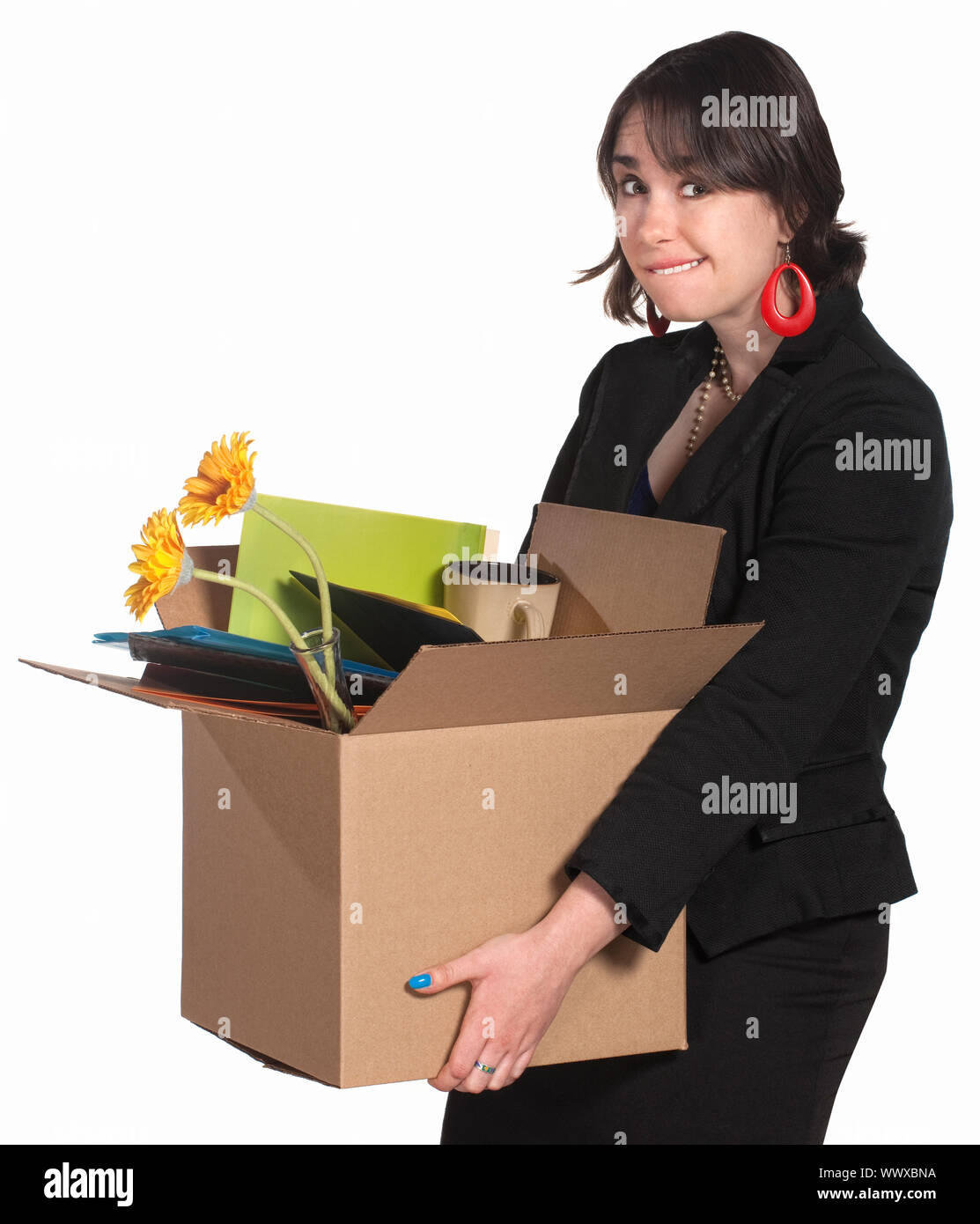Embarrassed professional woman carrying box of items Stock Photo - Alamy