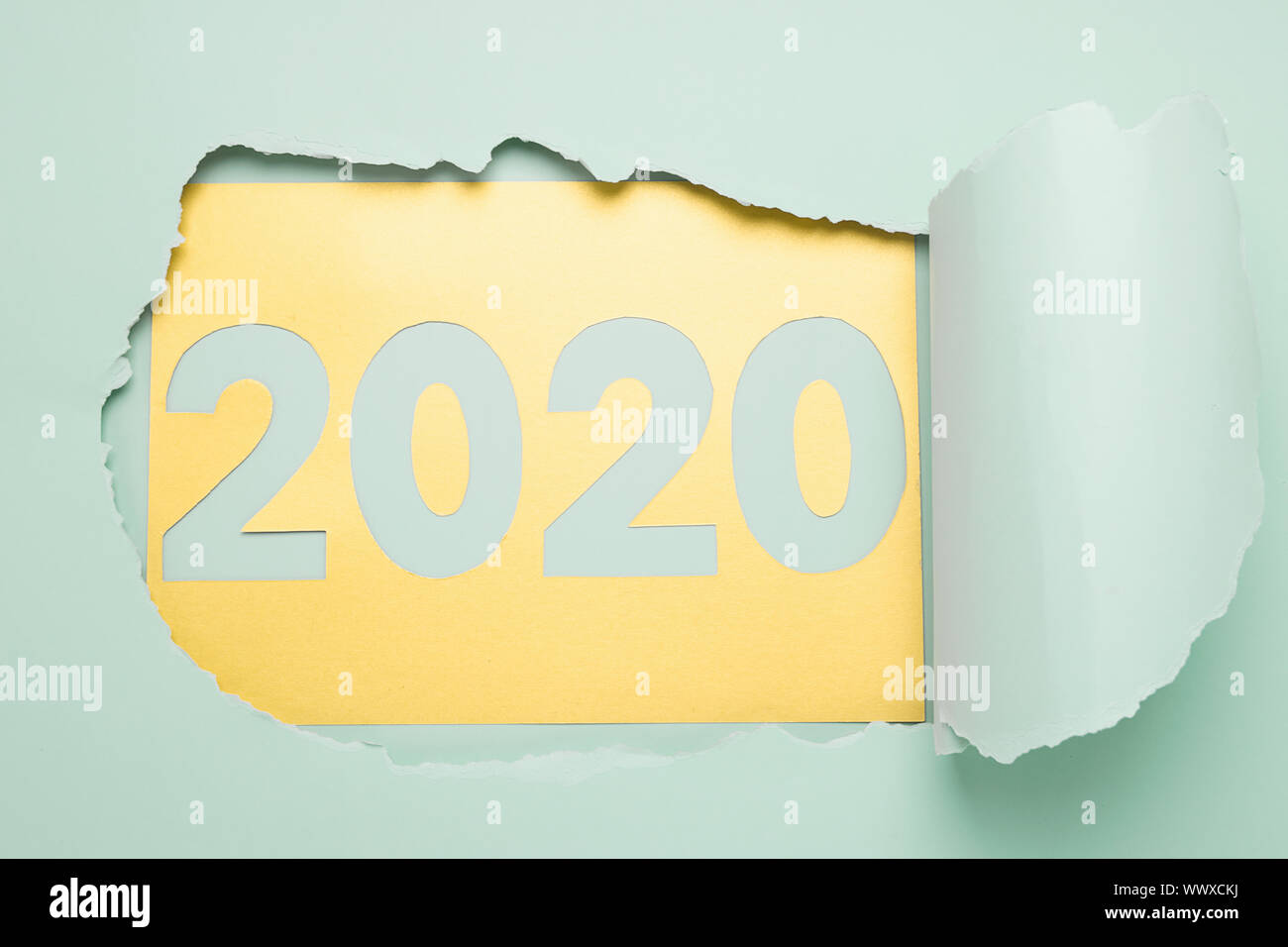 The symbol of the new year, numbers 2020 cut out of gold paper on a ...