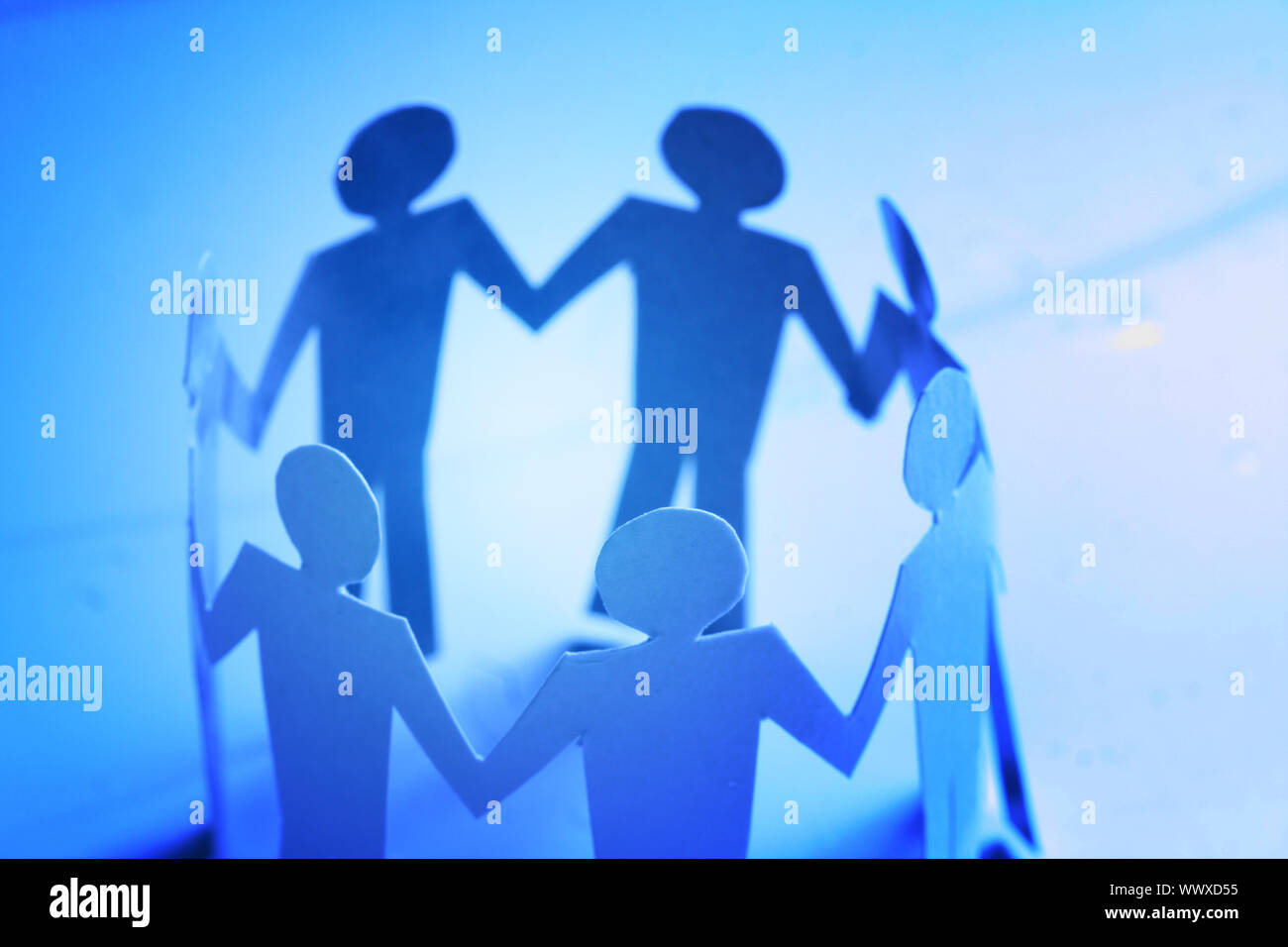 Group paper doll holding hands hi-res stock photography and images - Alamy