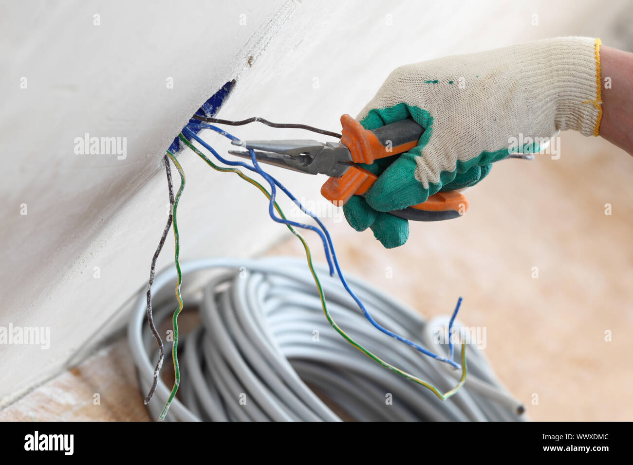 worker puts the wires in the wall Stock Photo - Alamy