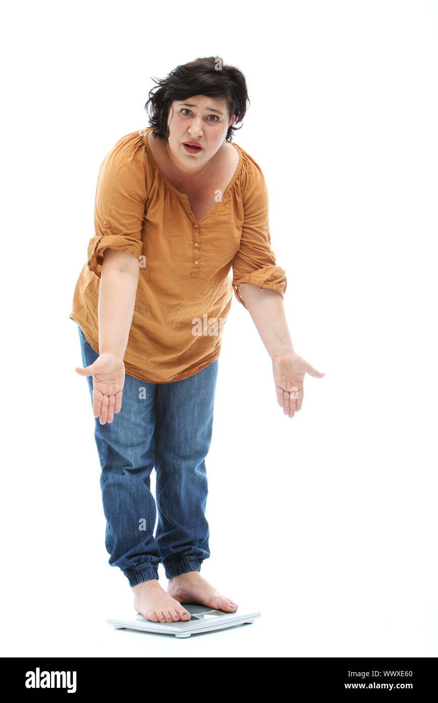 Women with weight problems is on a scale - cutout on white Stock Photo ...