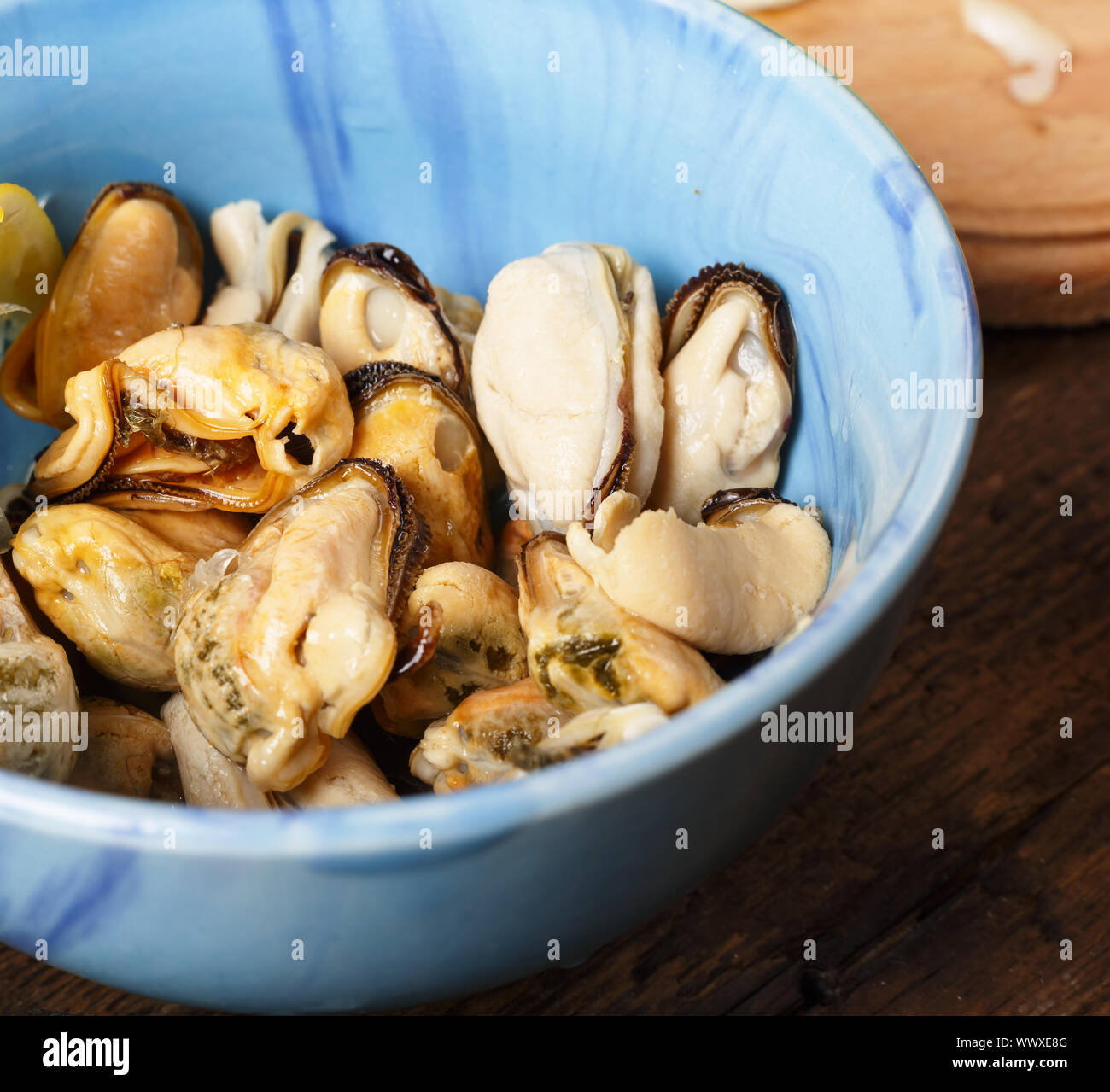 Salted peeled mussels with lemon Stock Photo - Alamy