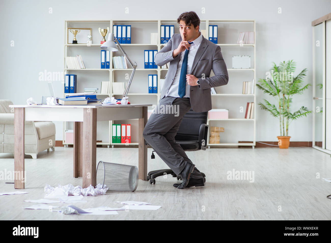 Businessman having fun taking a break in the office at work Stock Photo ...