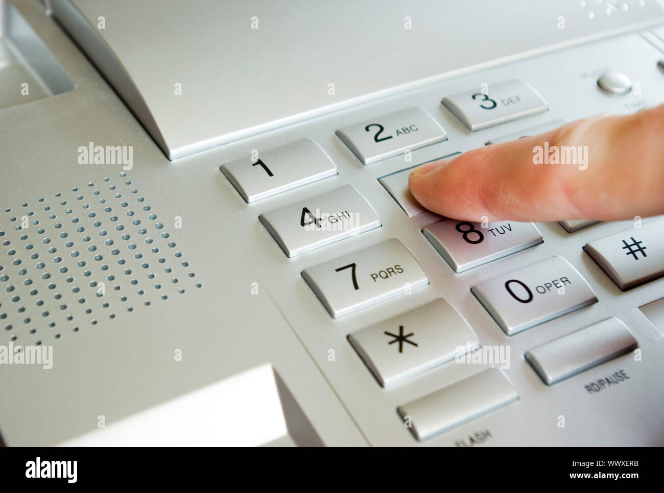 finger with grey telephone keypad Stock Photo - Alamy