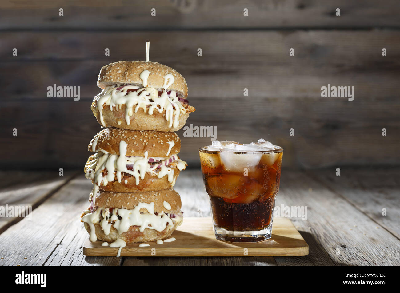 A huge burger and a glass of cola Stock Photo - Alamy