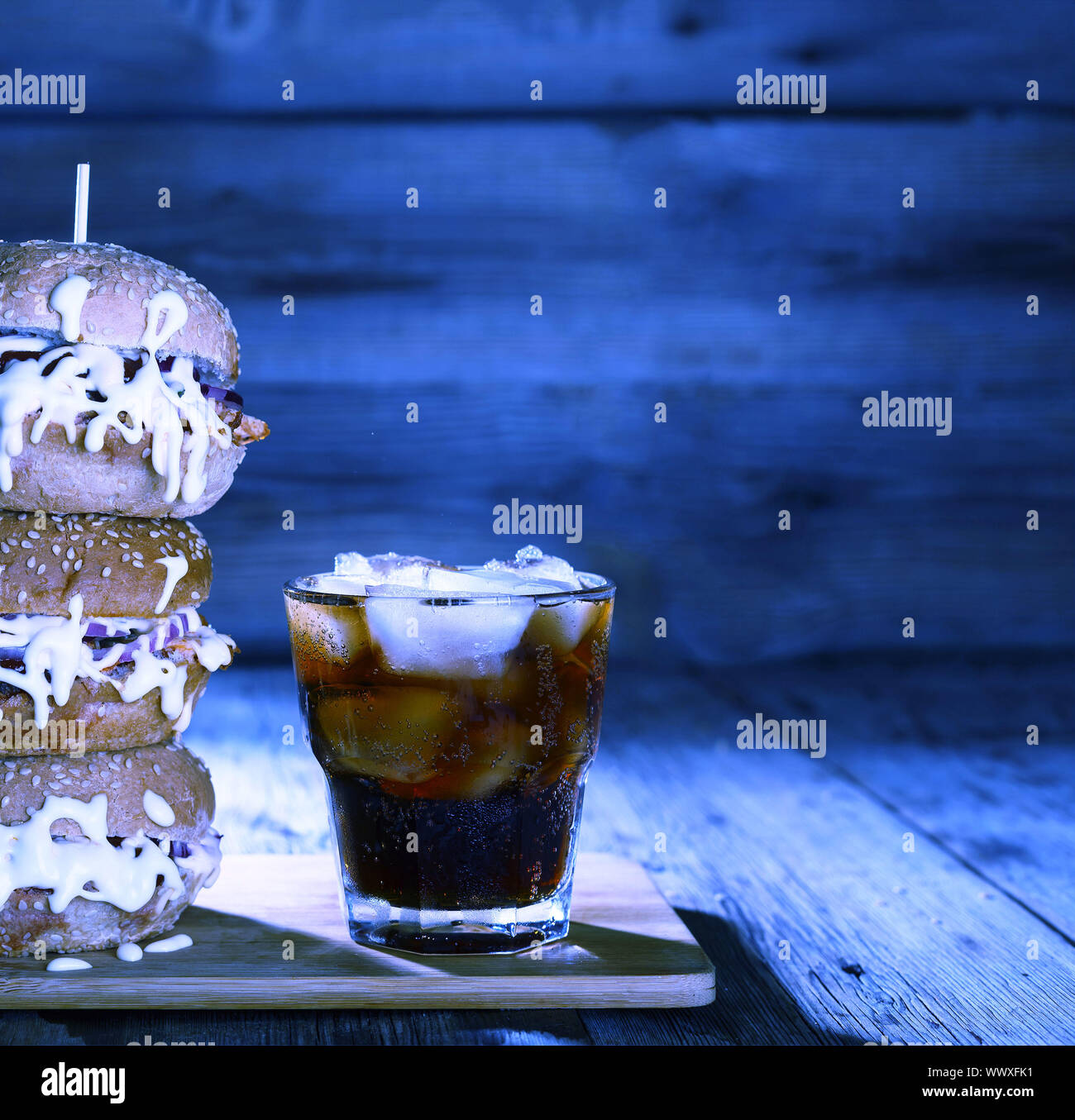 A huge burger and a glass of cola Stock Photo - Alamy