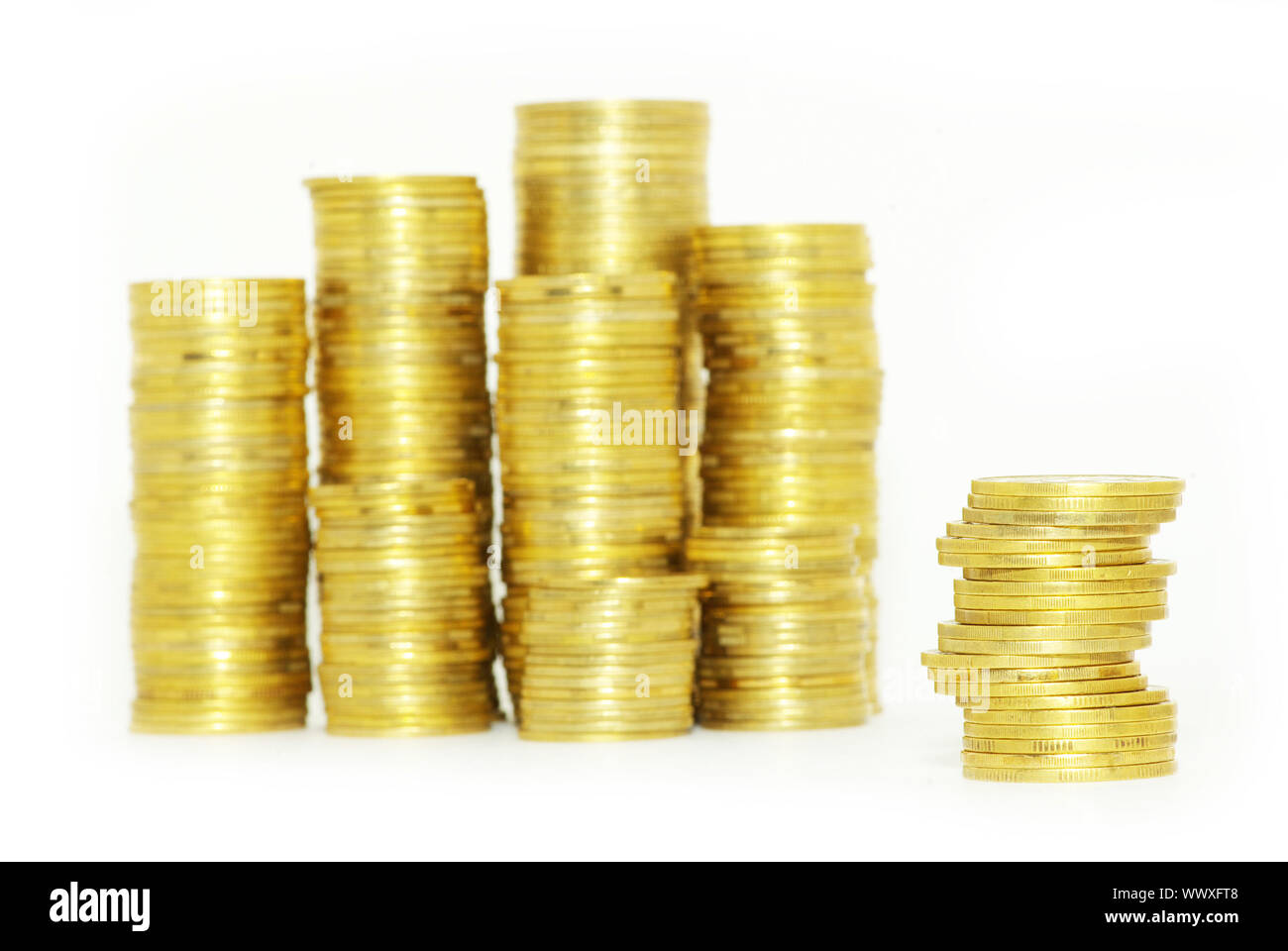 towers of coins isolated on a whiteness Stock Photo - Alamy